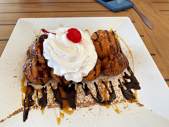 Dessert that demands attention! Caramelized bananas, whipped cream, and chocolate drizzle create a sweet finale worth saving room for.