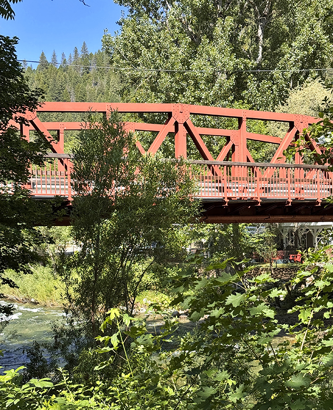 This isn't just a bridge; it's Downieville's red-painted connection between everyday life and river adventures waiting on the other side.