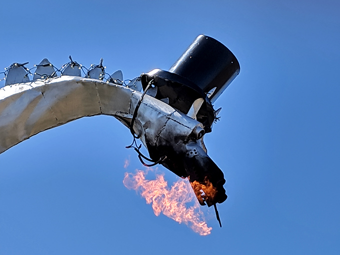 The payoff moment! Genuine flames shoot dramatically from the dragon's mouth, turning skeptics into believers with each fiery burst.