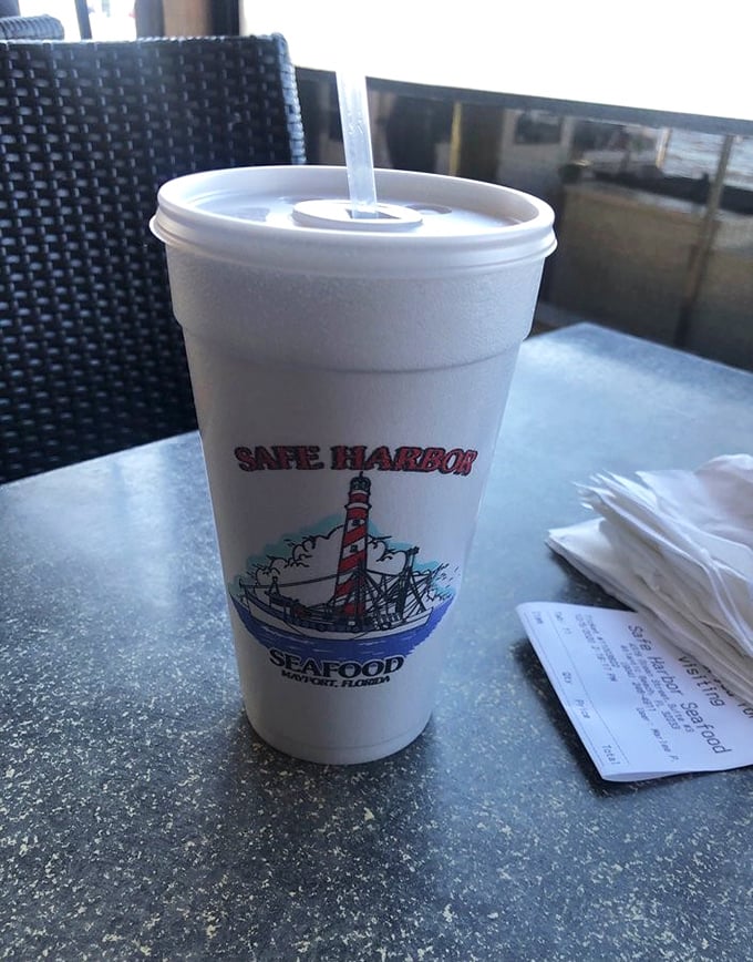 Even the cups tell a story here &ndash; a lighthouse logo reminding you that fresh seafood and coastal living go hand in hand.