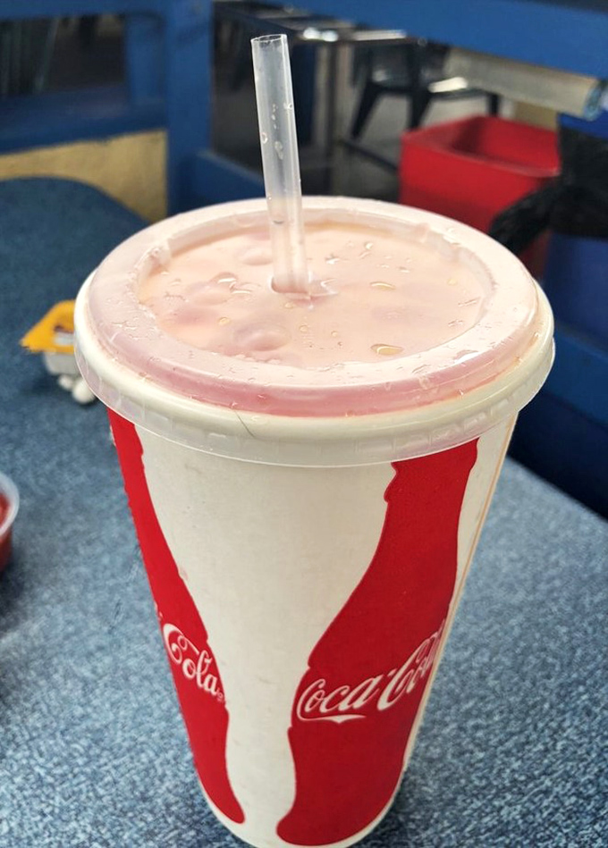 Even the drinks come in no-nonsense containers. This isn't about the vessel – it's about quenching your thirst between bites of seafood bliss.