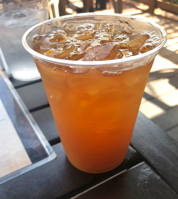 A perfectly amber iced tea catching the afternoon sun &ndash; because sometimes the simplest refreshment is exactly what the doctor ordered after miles on the trail.