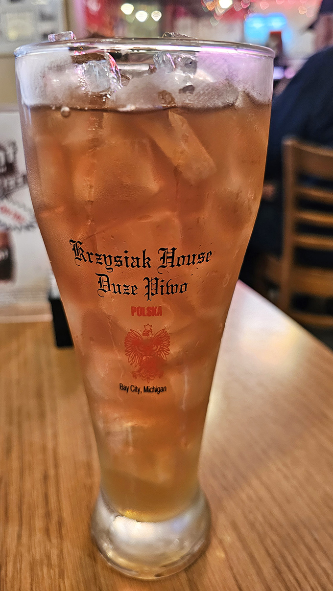A tall, cold drink in custom glassware—because sometimes the perfect accompaniment to Polish comfort food is simply permission to relax.