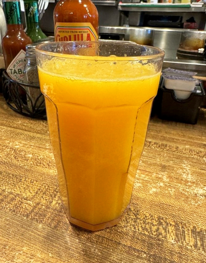 Fresh-squeezed orange juice in a glass big enough to make you feel like you're getting your day's worth of vitamin C in one glorious gulp.