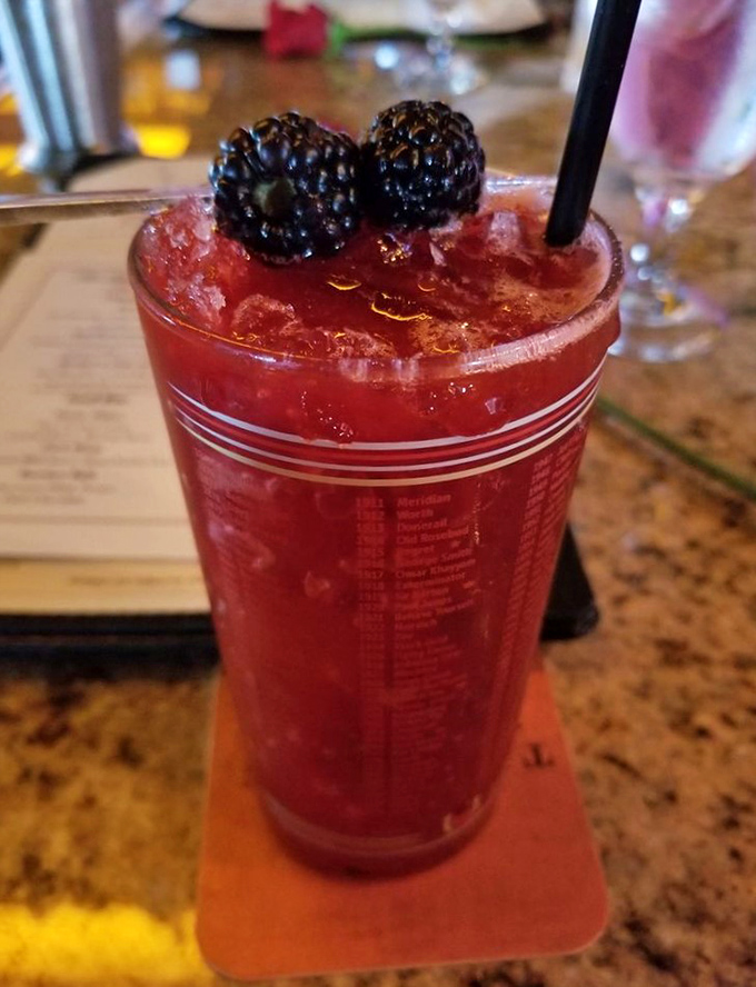 A ruby-red cocktail crowned with blackberries that says, "Yes, this contains antioxidants, so it's practically a health drink." Cheers to self-deception!
