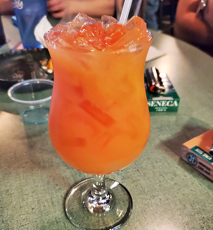 This sunset-colored cocktail isn't just a drink, it's vacation in a glass—the kind that makes you forget about Monday while you're still enjoying Sunday.