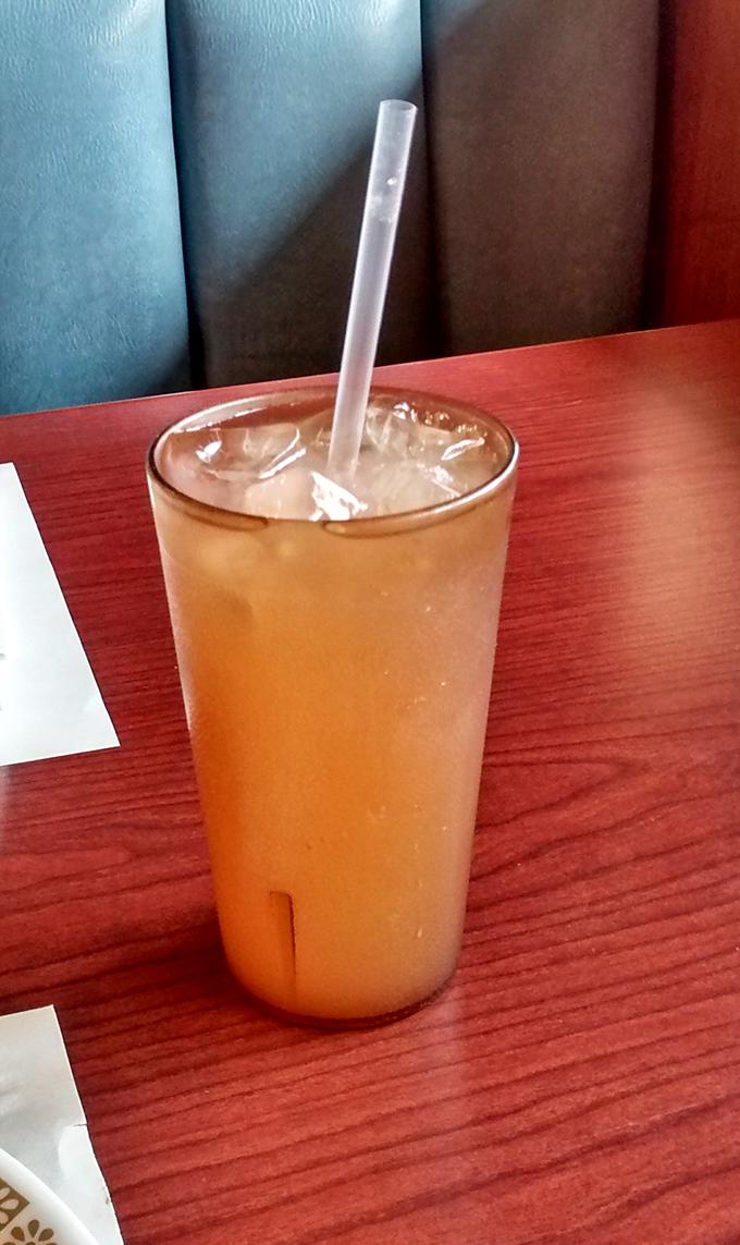 The kind of iced tea that arrives in a glass so full, taking that first sip becomes a strategic operation worthy of NASA planning.