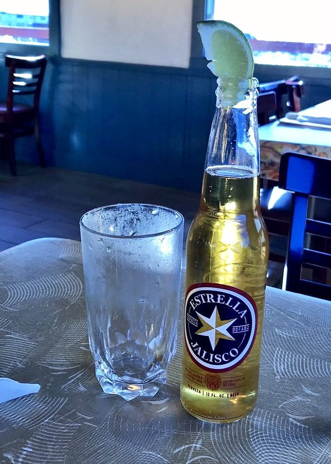 Nothing complements seafood like an ice-cold Estrella Jalisco with lime. The condensation on the bottle is nature's way of saying, "You've made an excellent choice today."