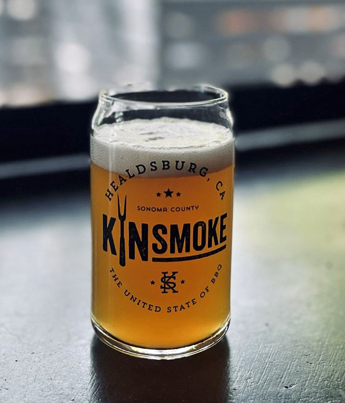 A golden brew in KINSmoke's custom glass &ndash; because after all that meat, you need something to wash away your barbecue sins.