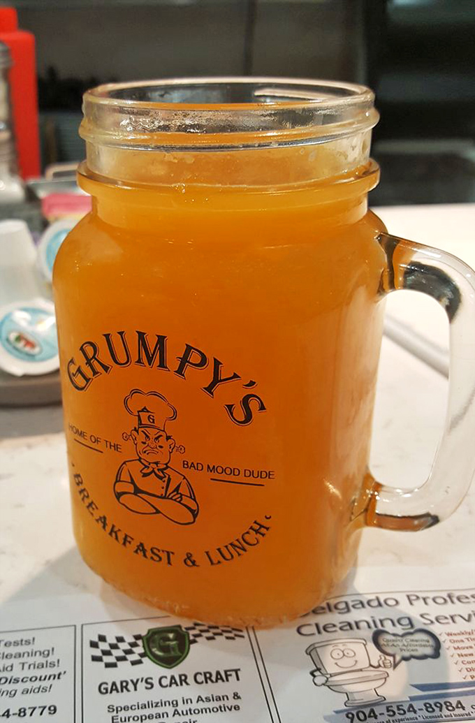 Fresh-squeezed Florida orange juice served in a mason jar with attitude. Sunshine you can drink while sitting next to the "Bad Mood Dude."