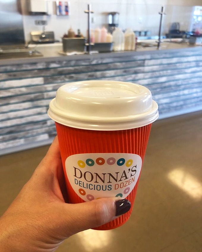 Even the coffee cups at Donna's sport the cheerful, colorful logo. The perfect companion for donut expeditions&mdash;because balance is important, right?