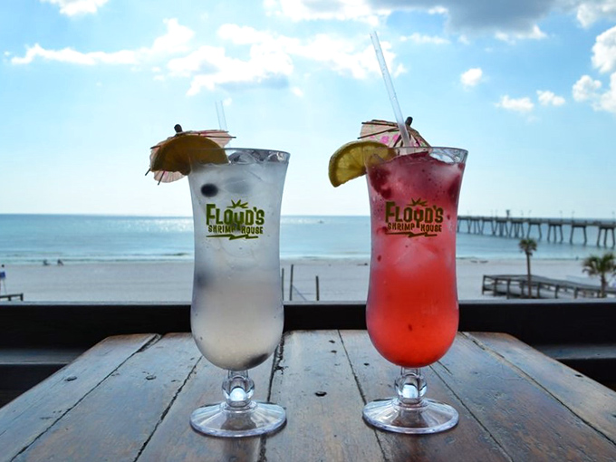 Colorful cocktails with tiny umbrellas against a Gulf backdrop &ndash; because nothing says "I'm on vacation" quite like drinking from glassware taller than your face.