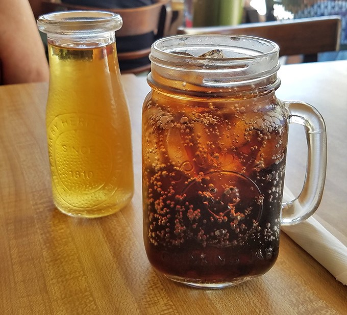 Mason jar beverages—because somehow drinks taste better when served in containers originally designed for preserving peaches.