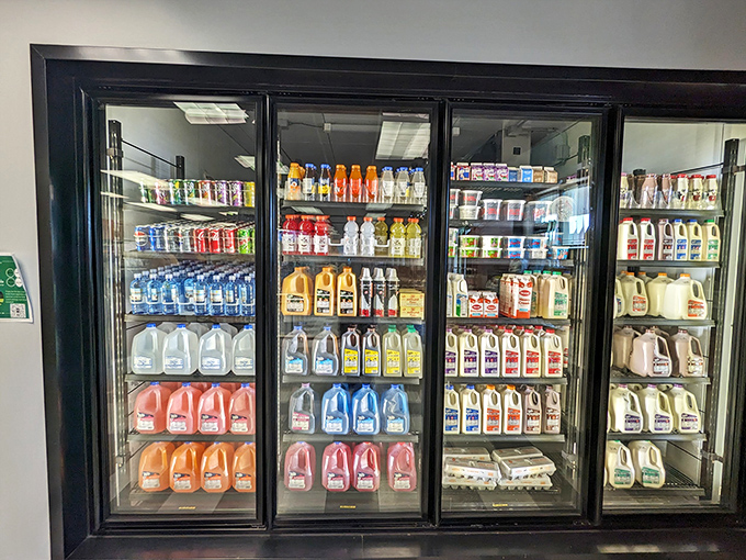 The dairy case isn't just refrigeration; it's a gallery showcasing Toft's full product line, from milk to buttermilk and everything in between.