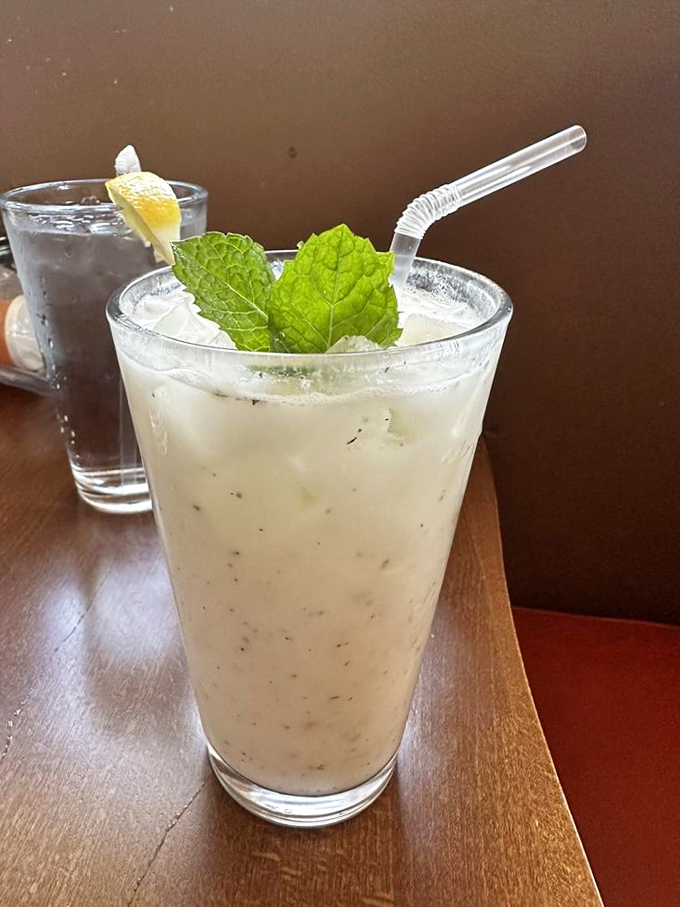 The yogurt drink, dotted with herbs and cucumber, offers cool respite between bites of spiced meats. Refreshment in its purest form.