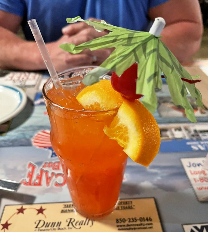 A vacation in a glass: this sunset-colored cocktail comes with its own tiny umbrella and promises of relaxation.