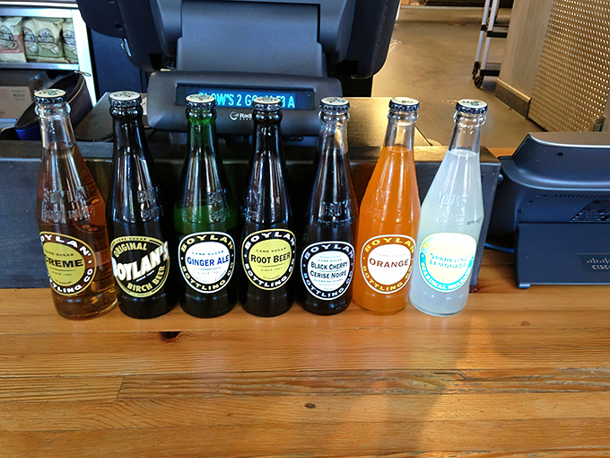 Liquid refreshment lineup! These craft sodas stand ready to cut through the richness of smoked meats like a well-timed punchline.