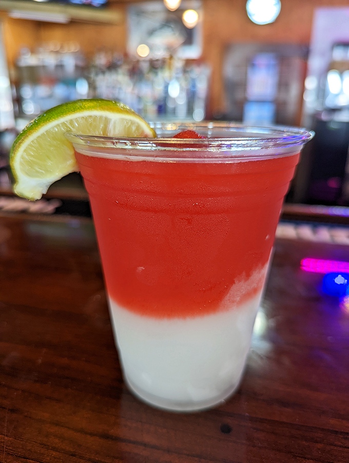 That two-toned tropical drink isn't just Instagram bait&mdash;it's liquid vacation with a lime wedge passport.