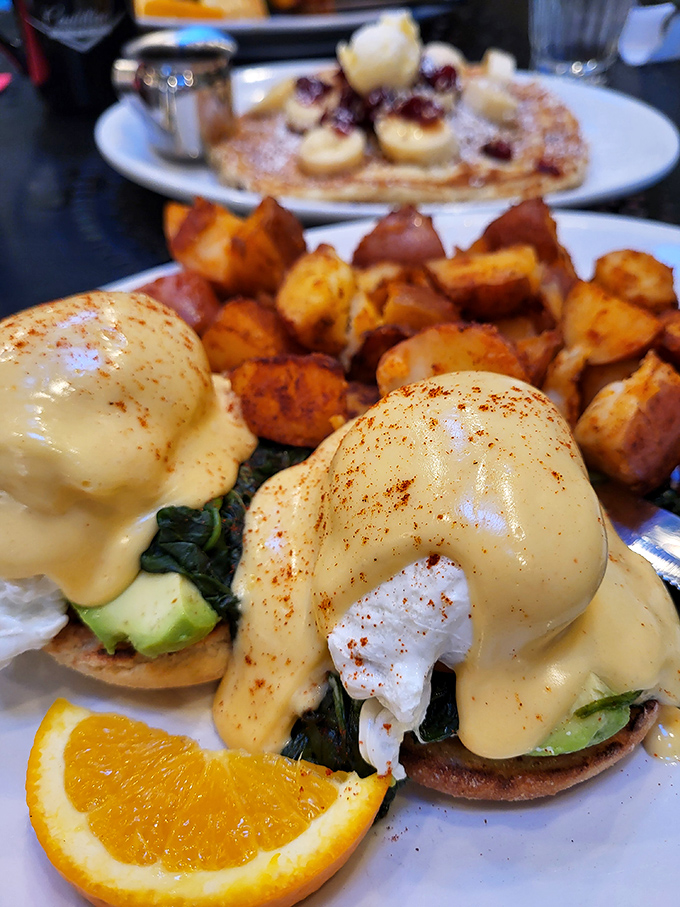 Eggs Benedict reimagined with avocado and spinach &ndash; proof that even classics deserve a Portland-style makeover occasionally.