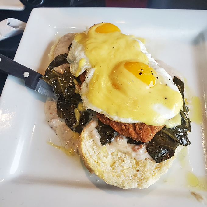 This Benedict isn't just breakfast&mdash;it's architecture. Perfectly poached eggs perched atop collards and what appears to be fried chicken create a Southern masterpiece.