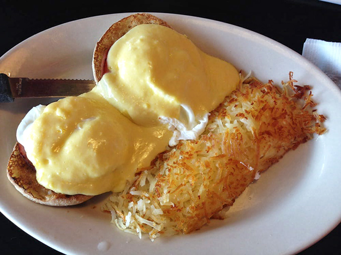 Eggs Benedict executed with textbook perfection. That hollandaise sauce blanket is keeping those eggs warm and happy.