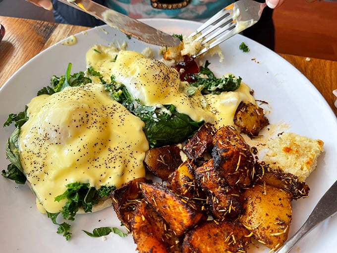 Eggs Benedict that's dressed better than most people at brunch&mdash;hollandaise-draped poached eggs atop fresh greens with herb-roasted potatoes playing a worthy supporting role.