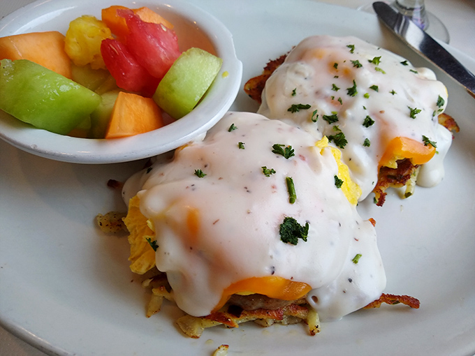 Eggs Benedict reimagined with crispy hash browns underneath and a blanket of creamy hollandaise that cascades down like a delicious waterfall.