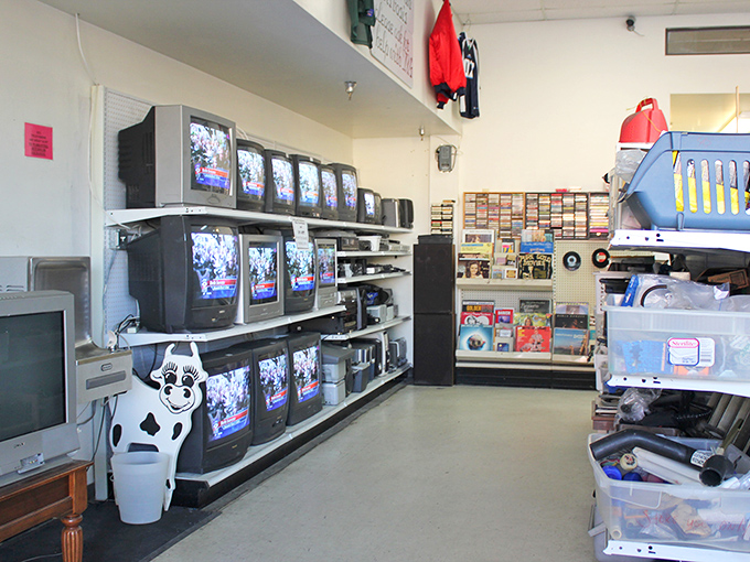 The electronics section: a museum of technological evolution where vintage TVs sit like prehistoric creatures waiting for their next chapter.