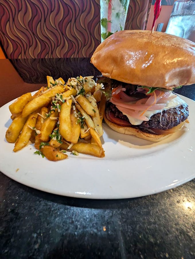 The elk burger &ndash; where wilderness meets culinary civilization, accompanied by fries that clearly didn't come from a freezer.