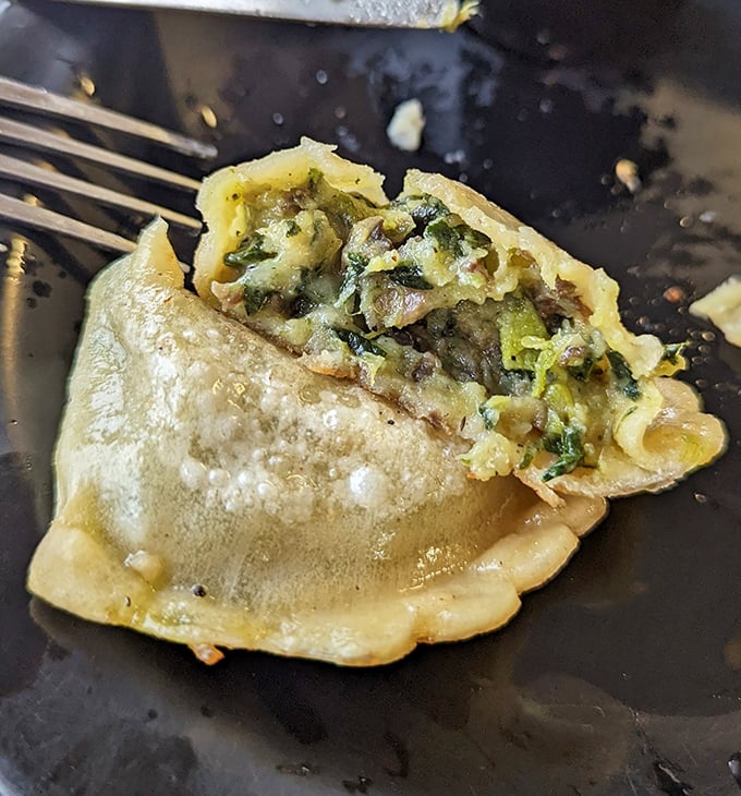 Cut open to reveal its secrets&mdash;this pierogi shows off a vibrant filling that's practically winking at you.