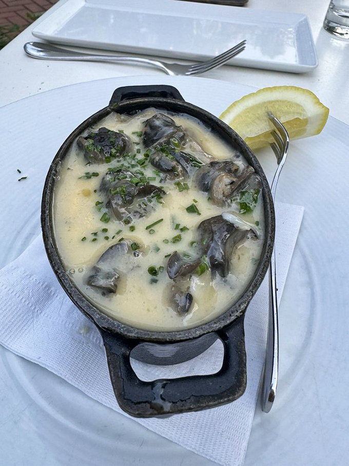 Escargot swimming in a creamy sauce with fresh herbs and a lemon wedge&mdash;the perfect introduction for the "I don't eat snails" crowd.