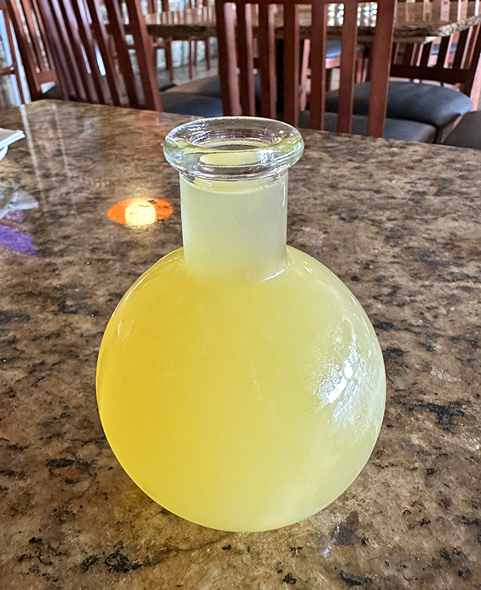 The honey wine arrives in its own little glass universe. Clear, golden, and potent&mdash;like liquid sunshine with a mischievous kick.