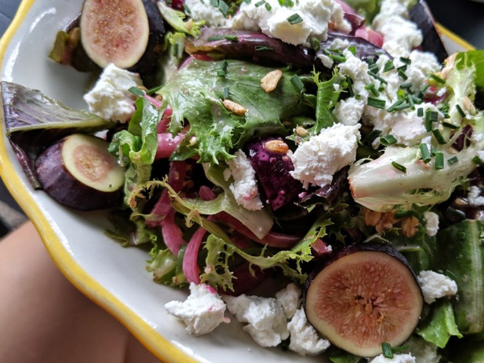 A salad that's dressed better than most people at brunch. Those figs and goat cheese are having the conversation we all wish we were part of.