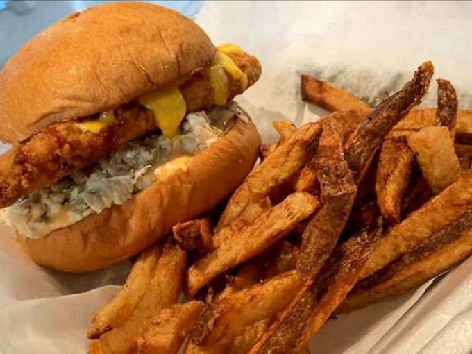 This isn't just a sandwich; it's edible architecture&mdash;crispy golden fish, melty cheese, and fries that deserve their own fan club.