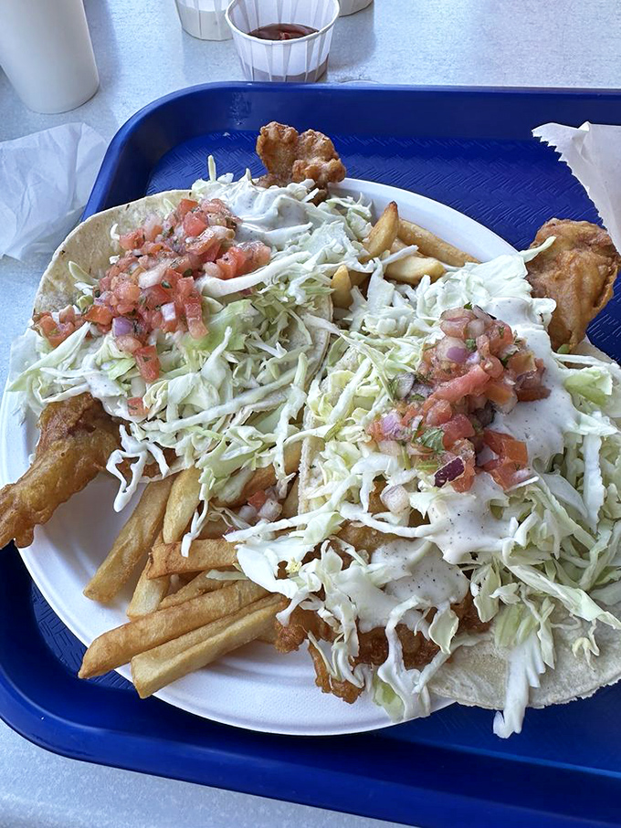 Fish tacos done right: crispy fish, crunchy cabbage, fresh pico, and a drizzle of sauce that brings the whole coastal fiesta together.
