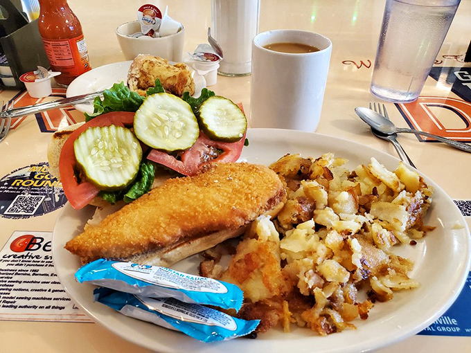 A fish sandwich that would make coastal cities jealous, paired with home fries that achieve the perfect crisp-to-tender ratio.