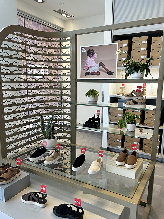 Modern shoe displays that turn footwear into art installations. Those 50% off tags are the real masterpieces, though.