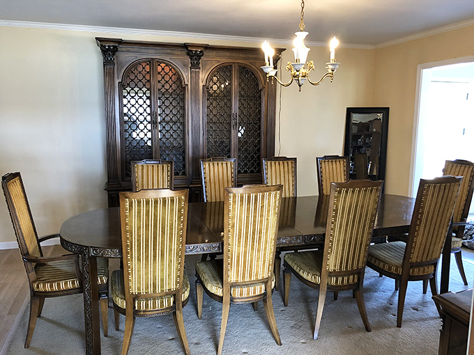 Imagine the dinner parties this elegant dining set has hosted&mdash;decades of holiday meals, spirited debates, and family announcements all absorbed into its polished wood.