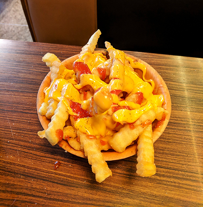 These cheese fries aren't just a side dish; they're a main event waiting in the wings, ready to steal the spotlight with their molten golden glory.