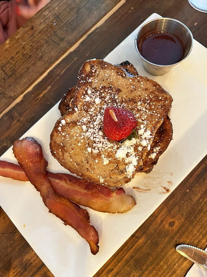 Their French toast transforms ordinary breakfast into an event, with a dusting of powdered sugar and fresh berries that make mornings worth waking up for.