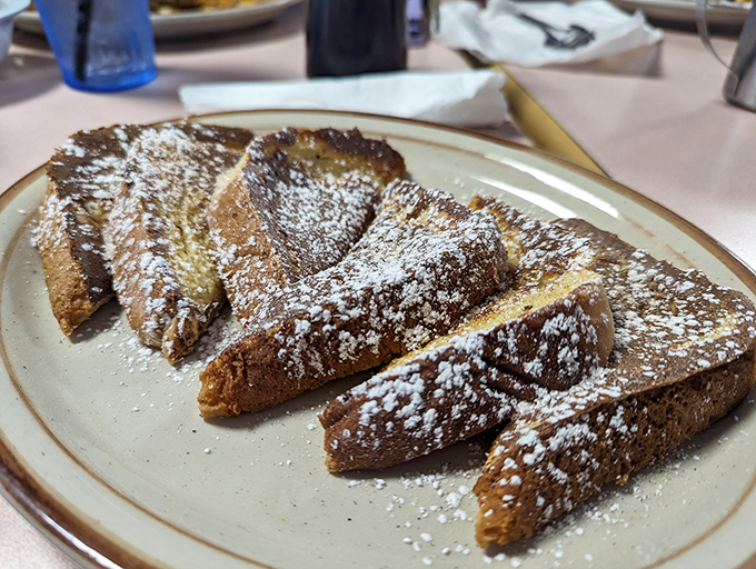 French toast dusted with enough powdered sugar to make Willy Wonka jealous &ndash; breakfast or dessert? Who cares?