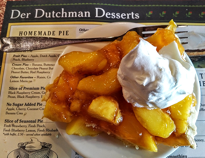 Fresh peach pie that captures summer in every bite, with fruit so perfectly glazed it looks like it's posing for its dessert glamour shot.