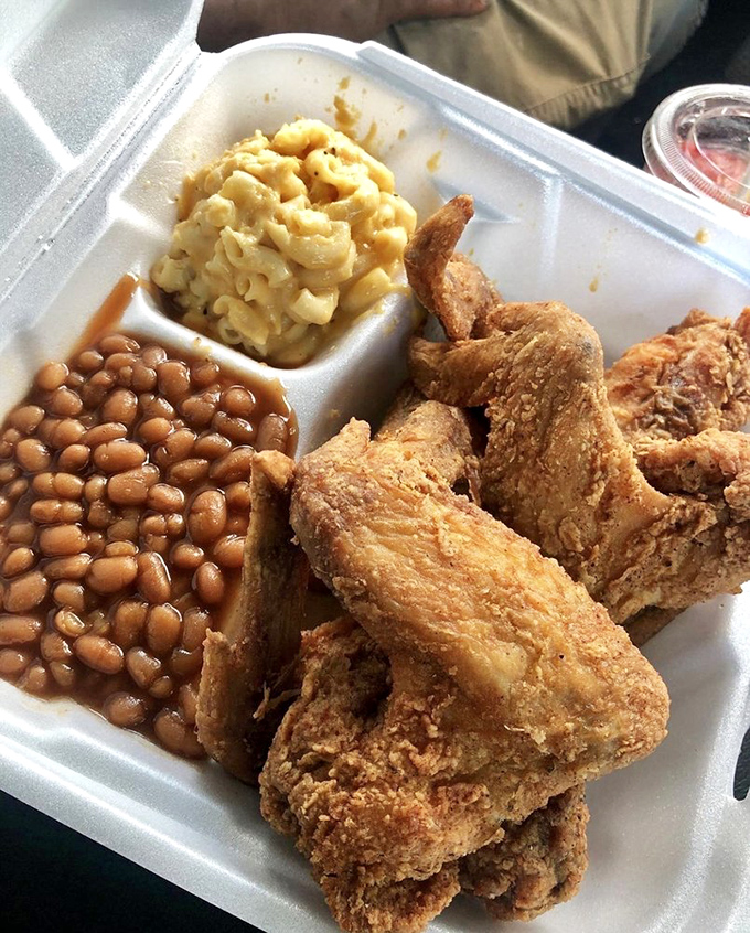 Golden fried chicken that would make the Colonel himself reconsider his recipe, paired with those essential Southern sides.