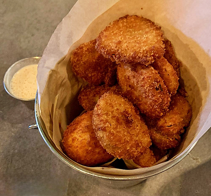 Golden fried pickles that crunch louder than autumn leaves, delivering tangy joy with every perfectly breaded bite you take.