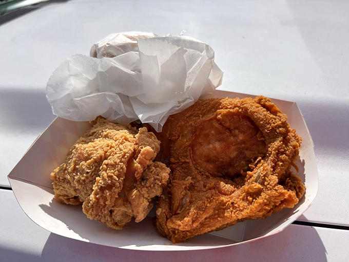 Portable happiness in a white paper container. This chicken won't make it home without at least one piece mysteriously disappearing.