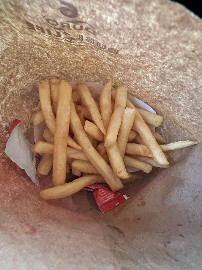 French fries nestled in their paper nest. Crispy on the outside, fluffy inside&mdash;the supporting actors that sometimes steal the show.