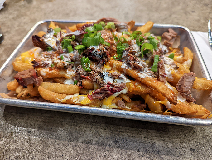 Loaded fries that blur the line between side dish and main event &ndash; a golden, cheese-draped canvas for smoky meat masterpieces.