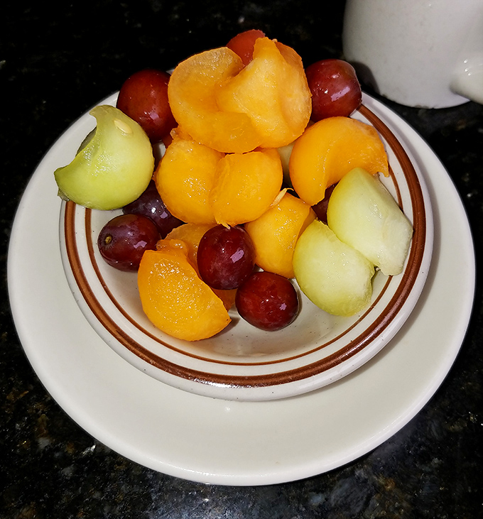 Fresh fruit that doesn't apologize for being healthy amid decadence. These vibrant bites offer a moment of virtue in a temple of indulgence.