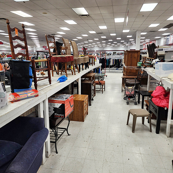 Furniture purgatory, where dining sets and side tables await their second chance at domestic bliss. That blue sofa has stories to tell.