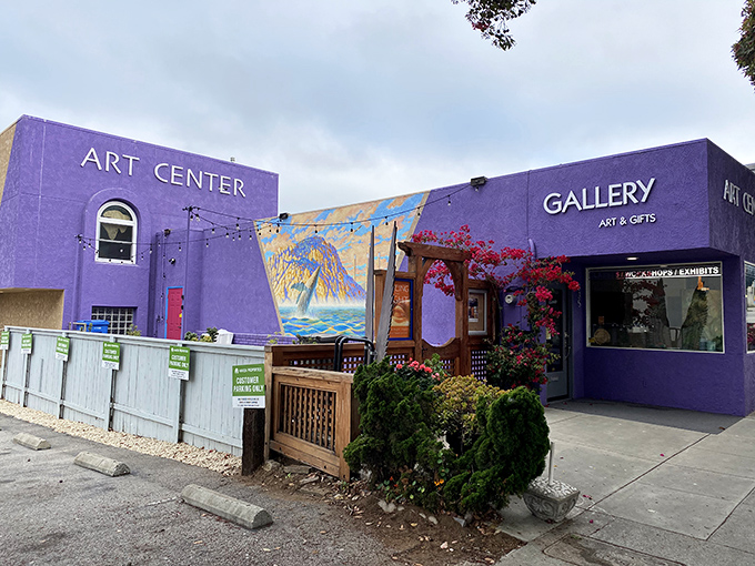 Purple buildings housing art galleries prove that sometimes bold color choices create exactly the right kind of attention.